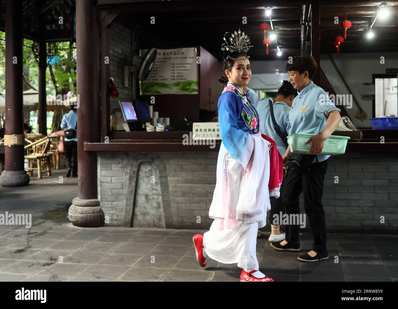 230814 -- CHENGDU, Aug. 14, 2023 -- A woman prepares for her opera ...
