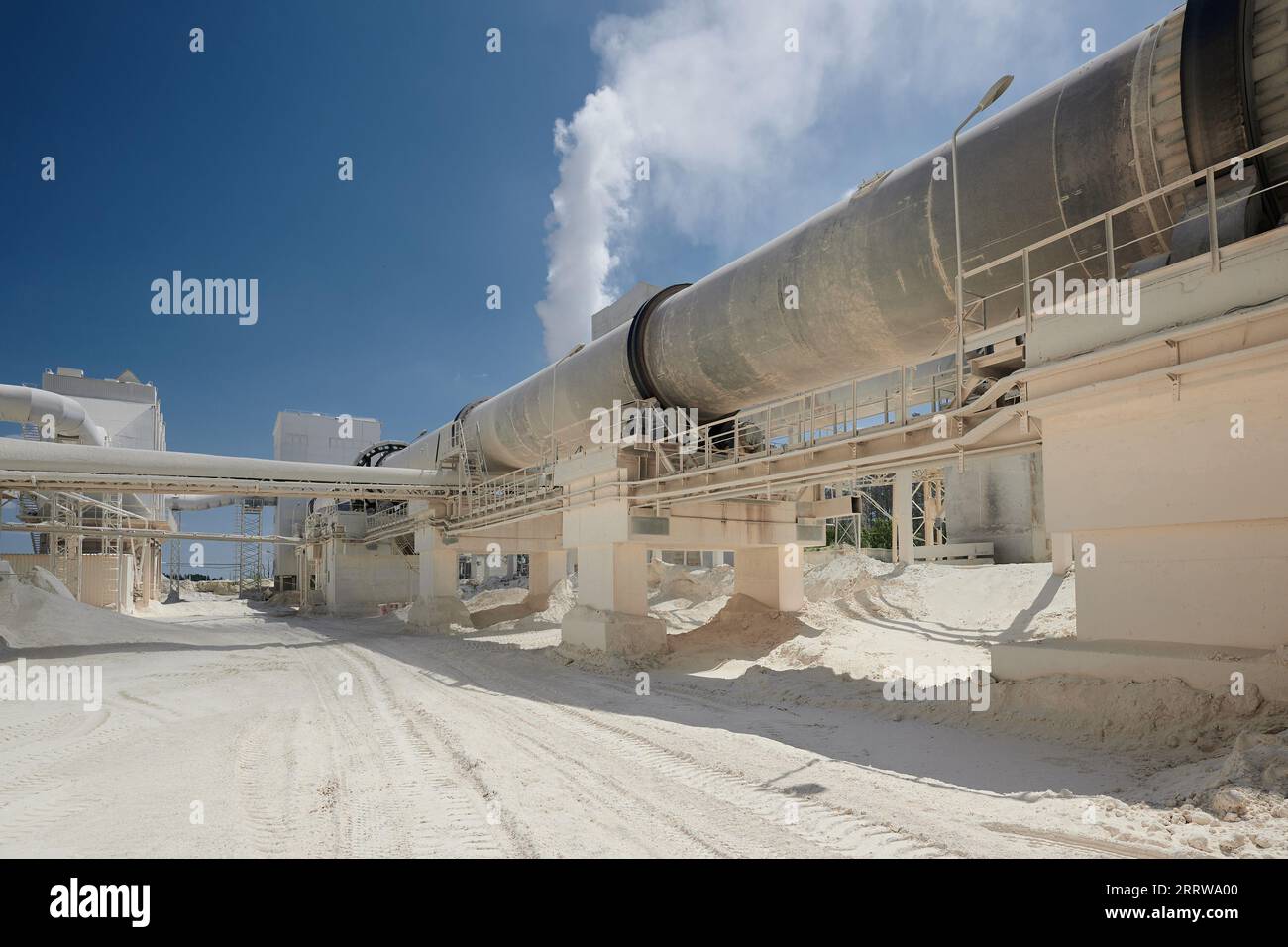 Pipe of turning calcium carbonate burning furnace at plant Stock Photo ...