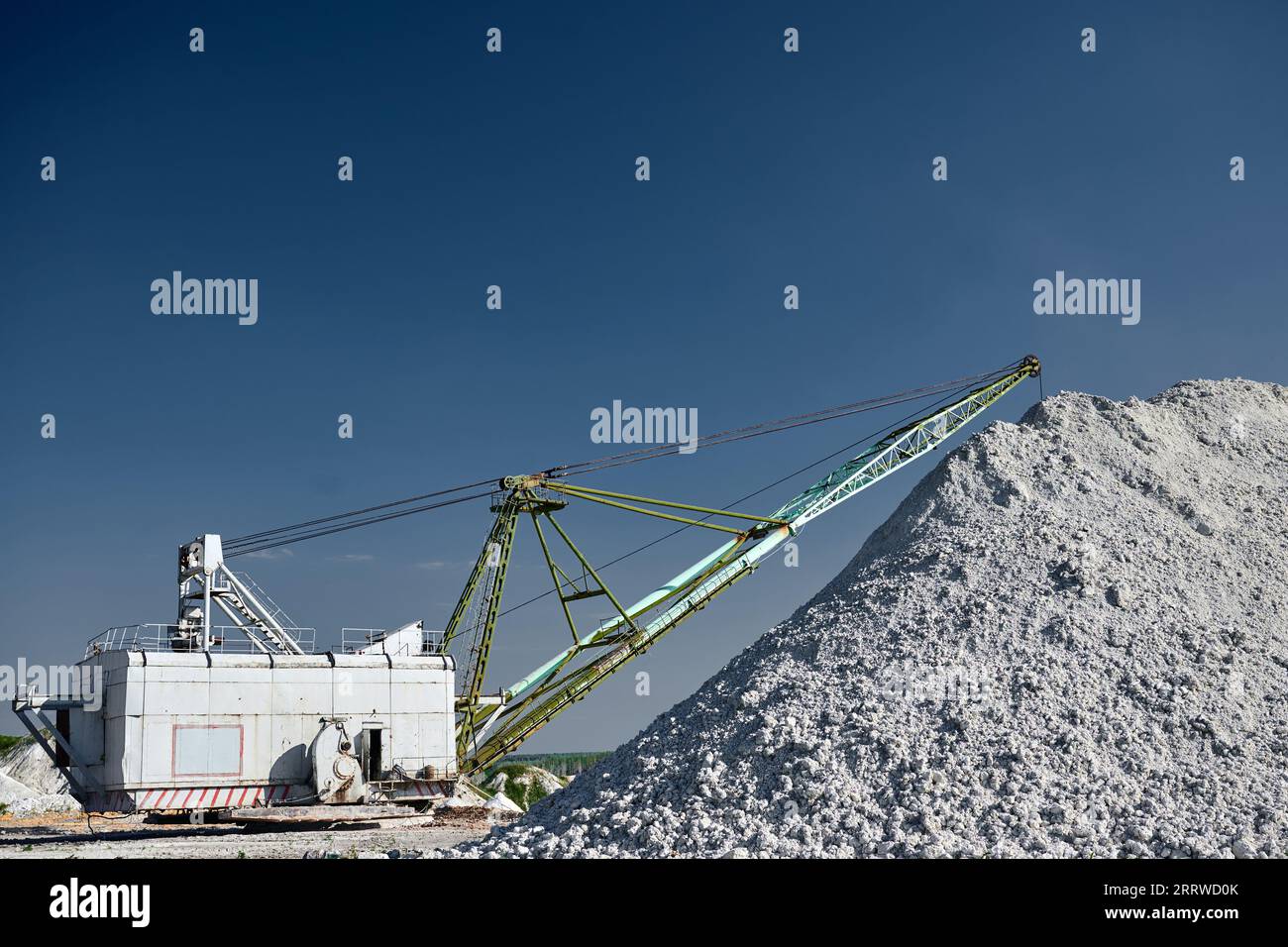 Walking excavator in process of chalk mining in open quarry Stock Photo ...