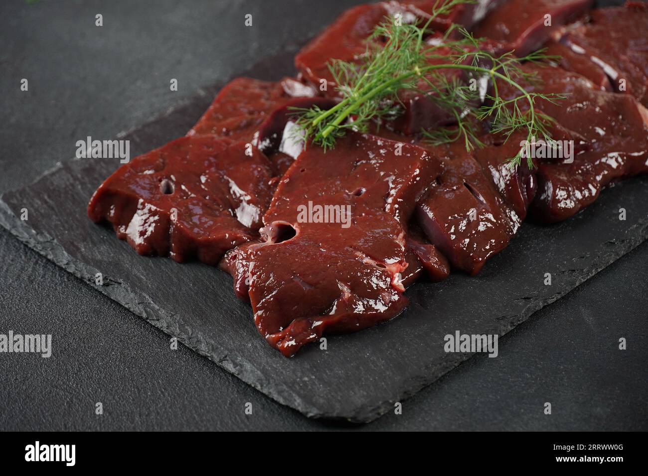 Fresh Raw beef liver on a slate board Stock Photo - Alamy