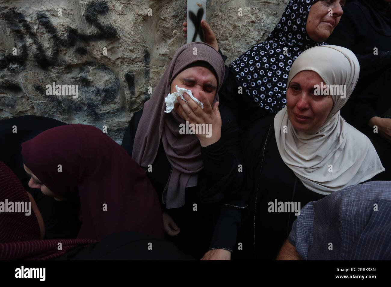 230817 -- JENIN, Aug. 17, 2023 -- People mourn during the funeral of ...