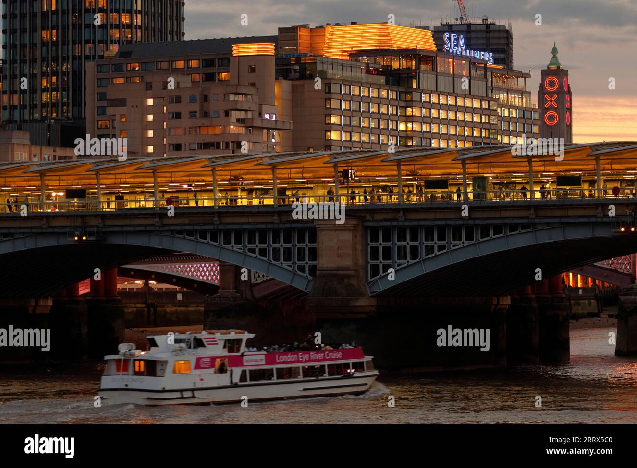 Blackfriars bridge, Sea Containers building, Oxo tower and a tourist ...