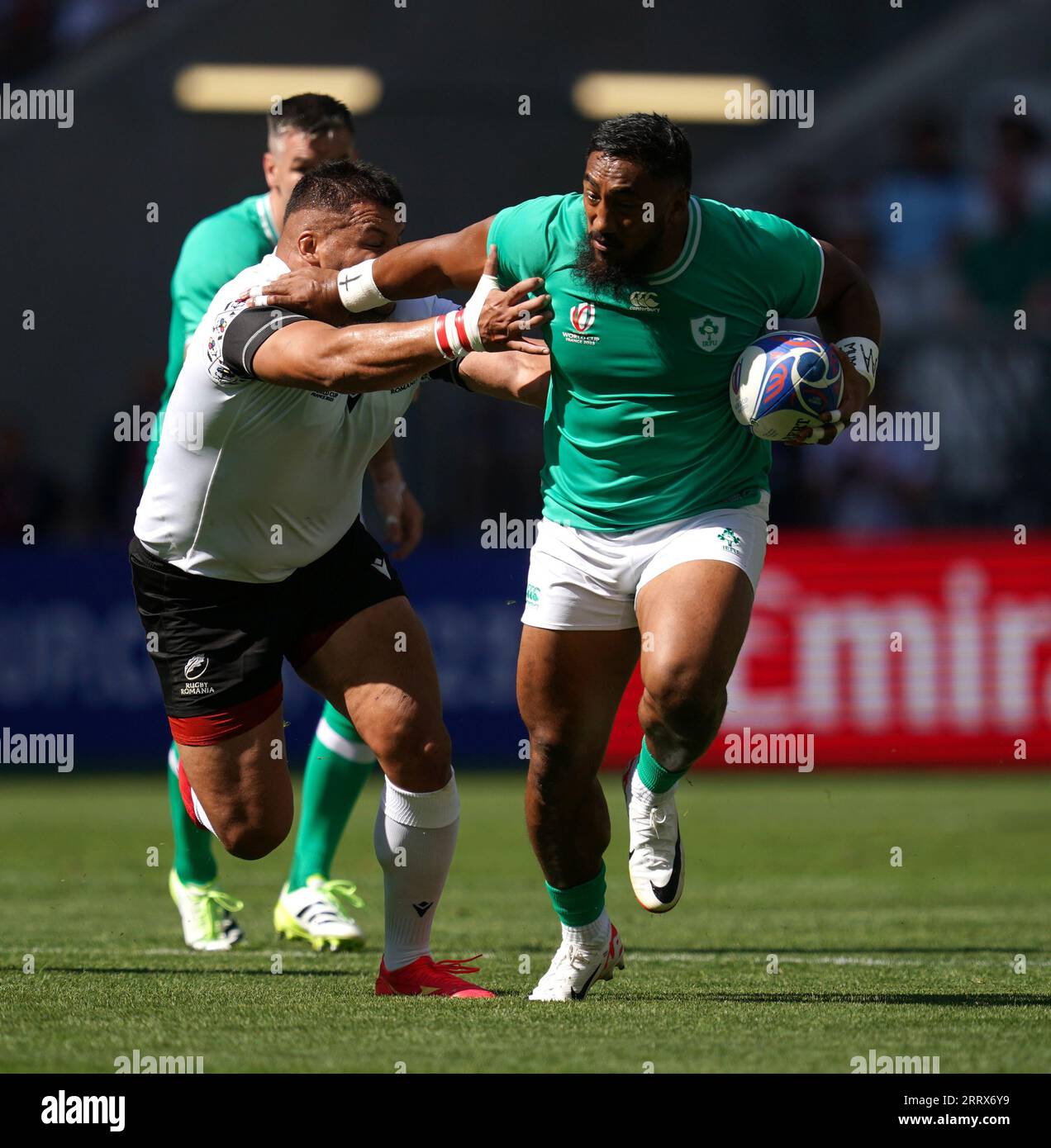 Ireland's Bundee Aki holds off a tackle during the Rugby World Cup Pool ...