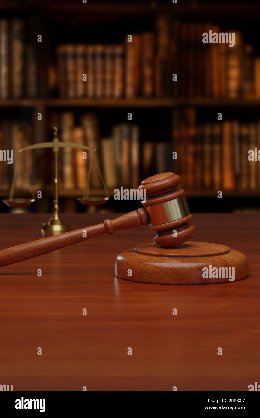 Wooden gavel and justice scales with defocused library in the ...