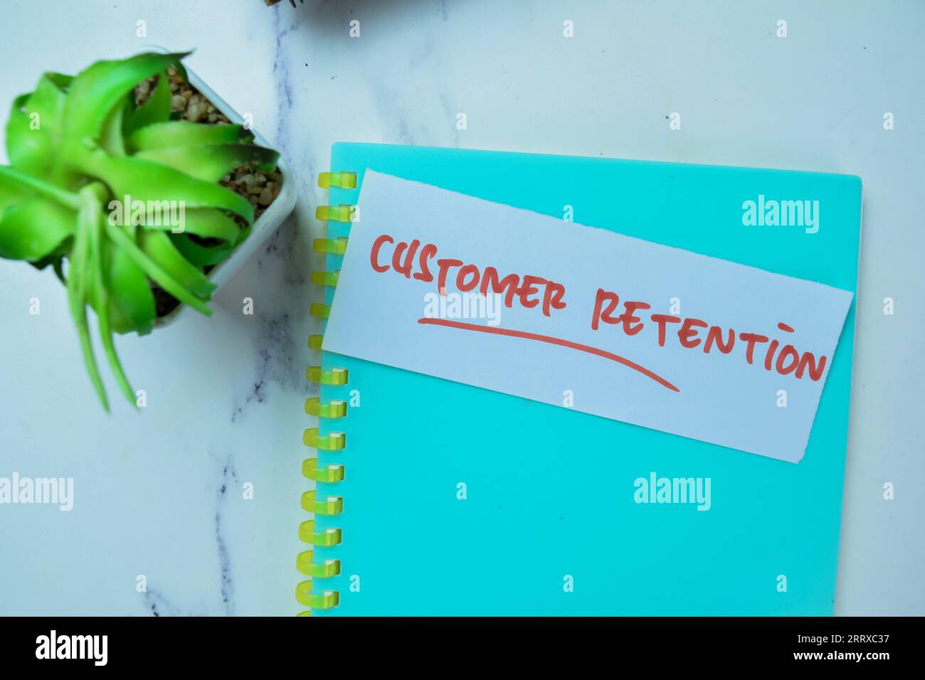 Concept of Customer Retention write on sticky notes isolated on Wooden ...