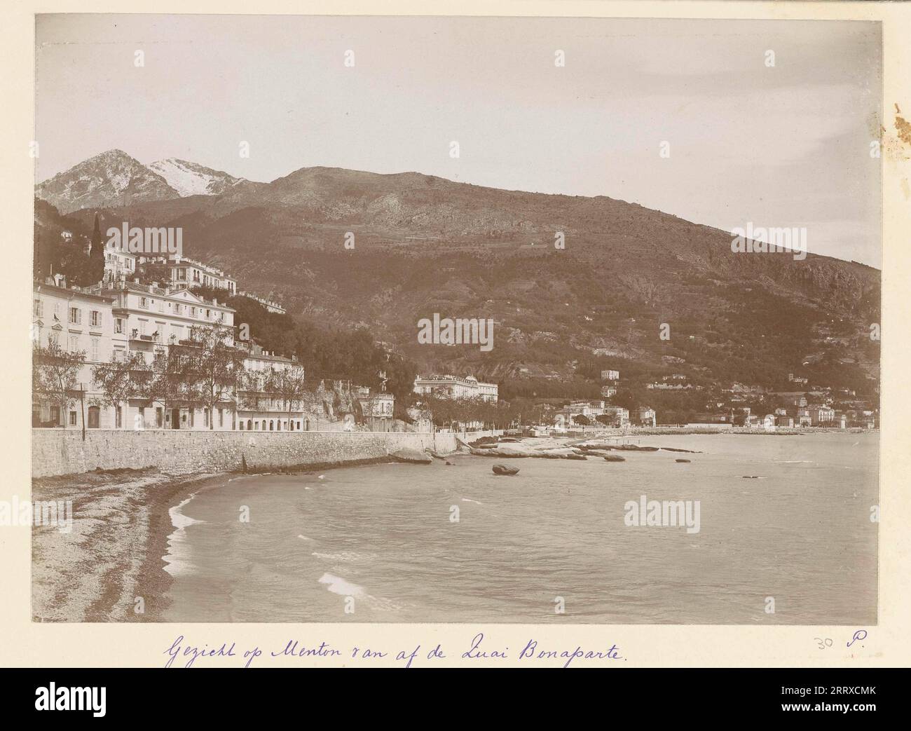 Menton seen from the coast. In the foreground there are buildings on ...