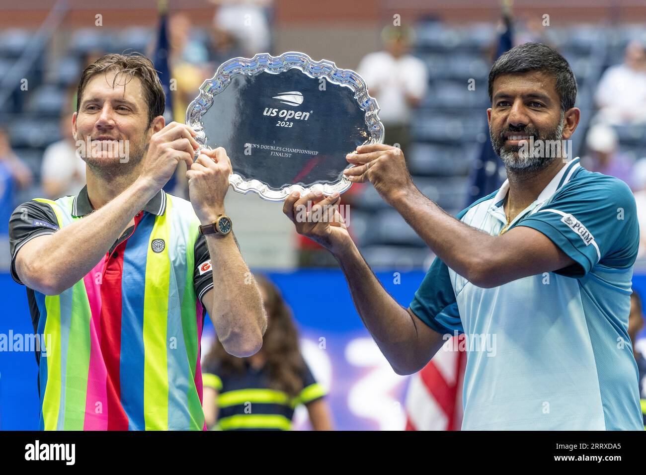 Matthew Ebden of Australia and Rohan Bopanna of India hold their runner ...