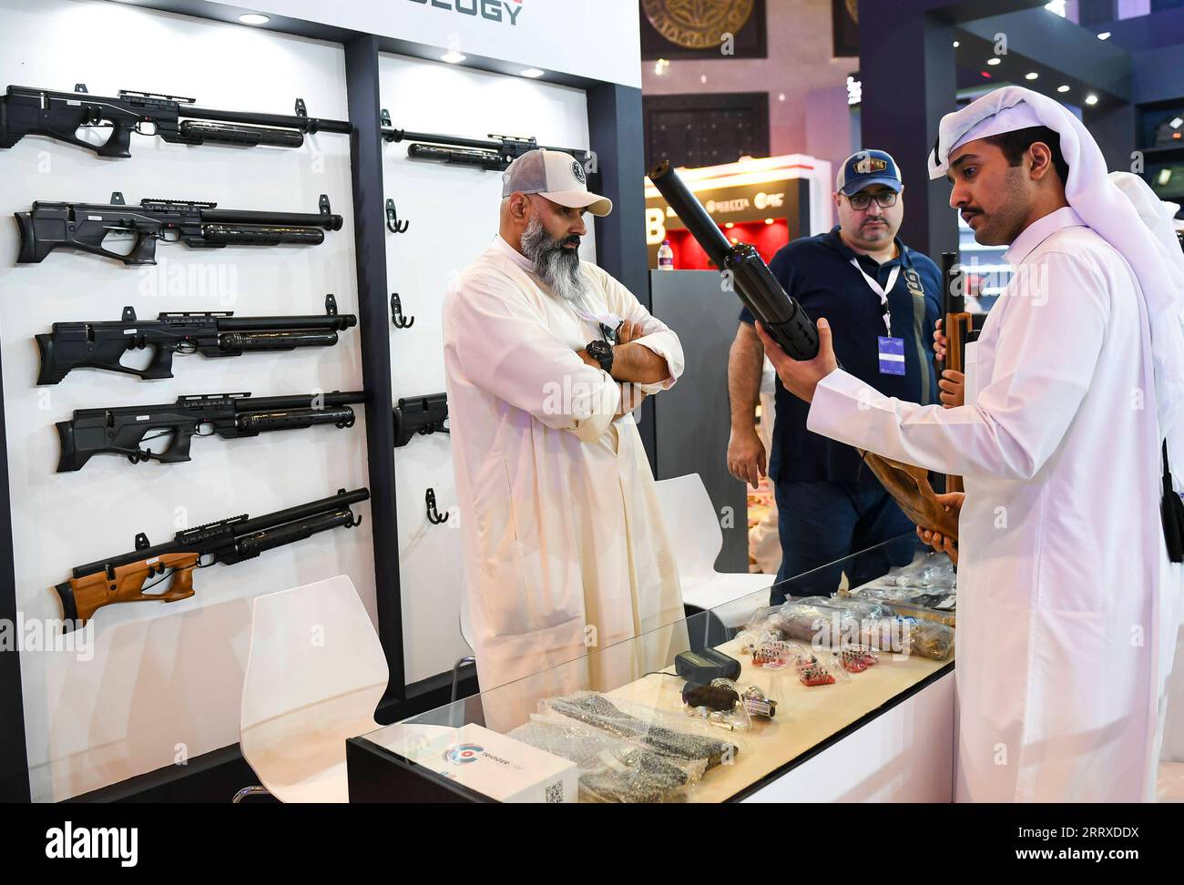 230905 -- DOHA, Sept. 5, 2023 -- People look at hunting rifles in the ...
