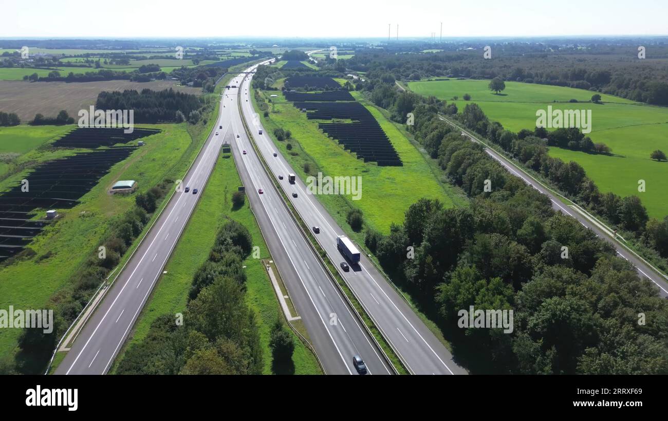 Aerial view on the A7 motorway in northern Germany between fields and ...
