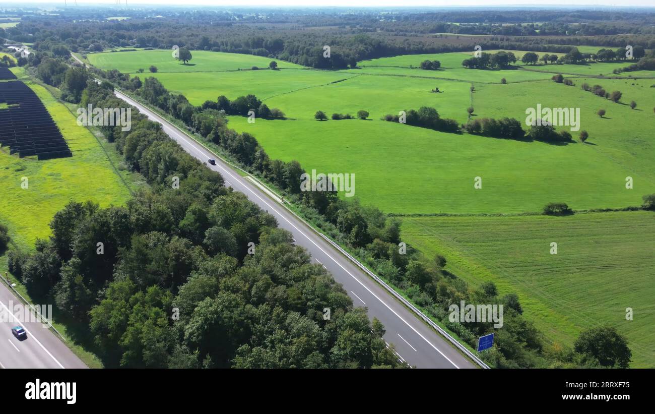 Aerial view on the A7 motorway in northern Germany between fields and ...
