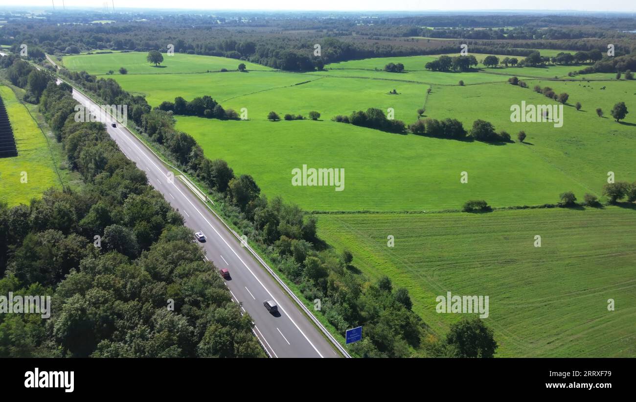 Aerial view on the A7 motorway in northern Germany between fields and ...