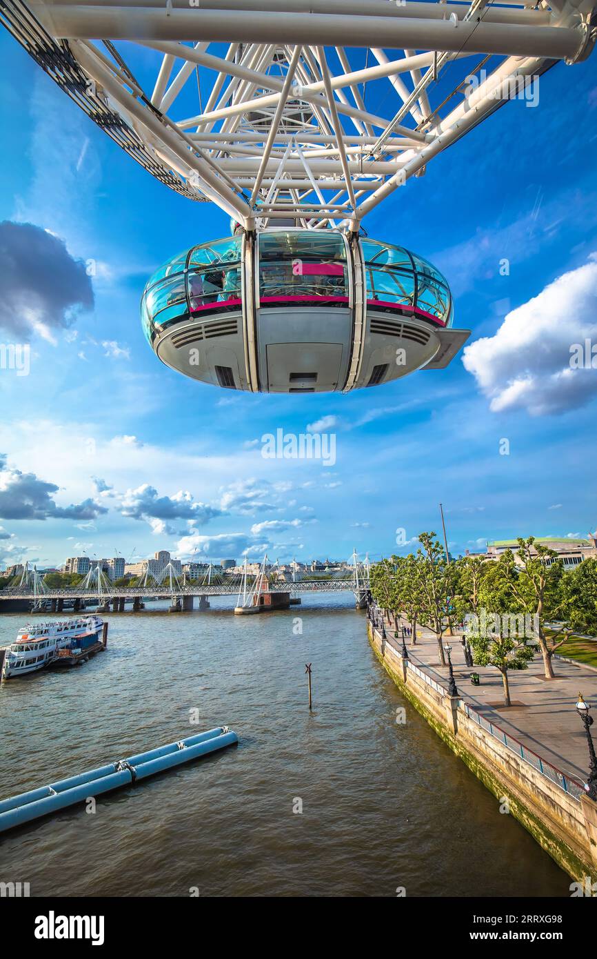 Scenic giant ferris wheel on Thames river in London view, capital of ...