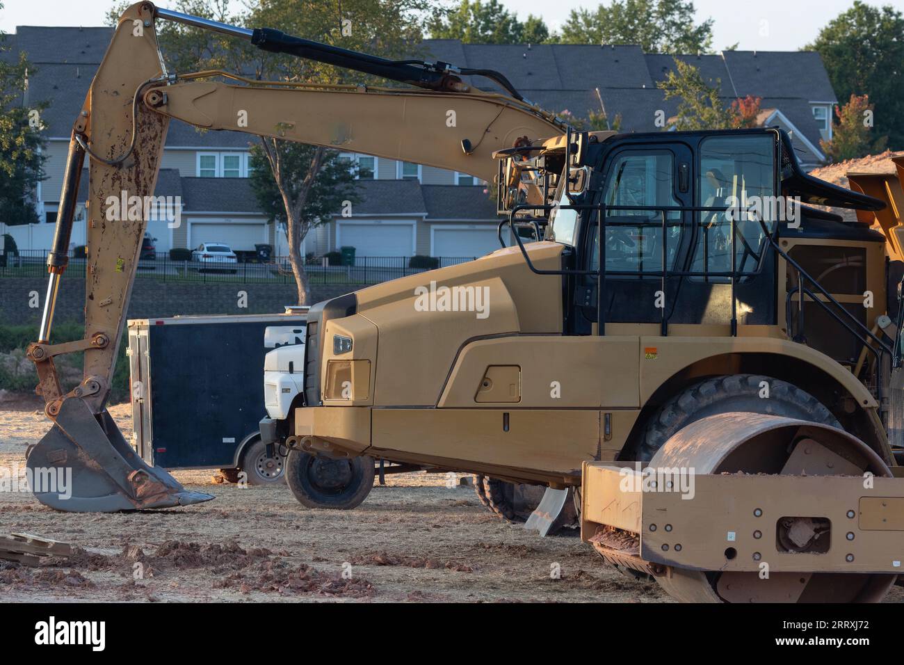 Heavy-duty trucks and equipment at a construction site near a ...