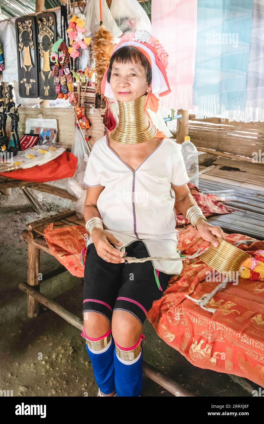 An elderly Karen long-neck tribe woman is seen sitting at her ...