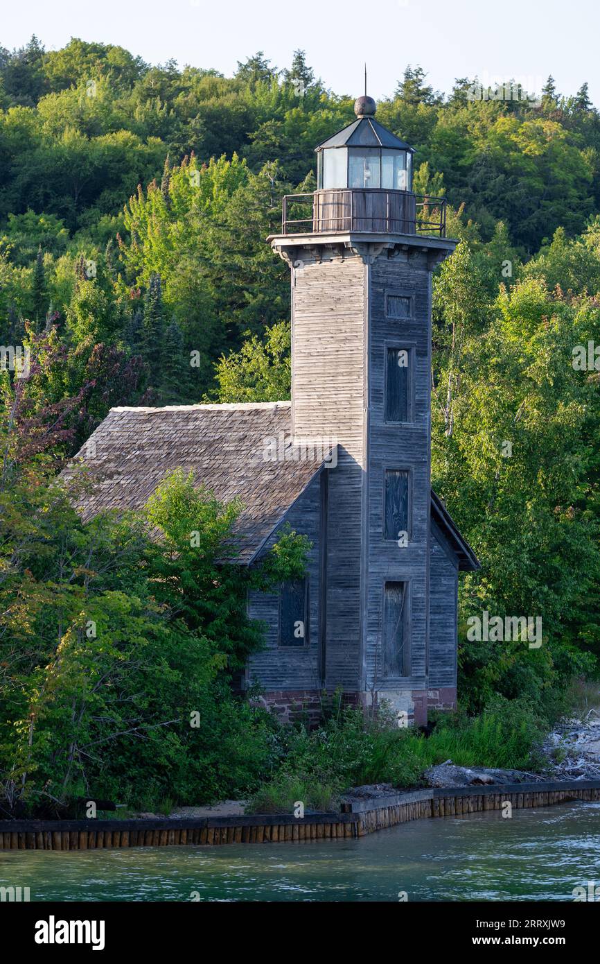 Wild black bear at the base of the East Channel Lighthouse in Munising ...