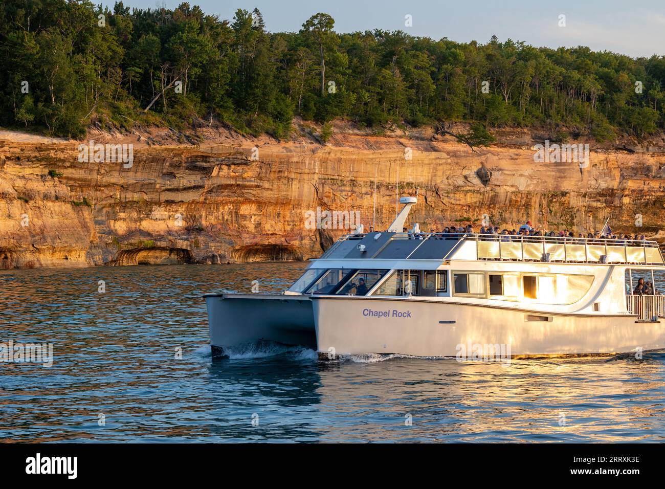 Catamaran full of tourists along Pictured Rocks National lakeshore ...
