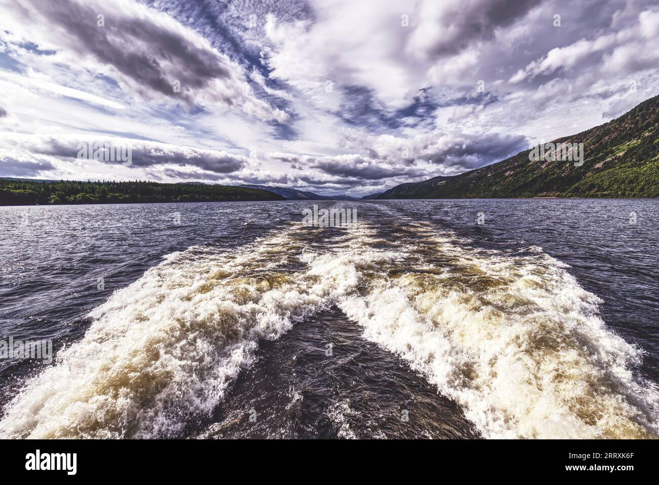 Racing the Horizon: Foamy Ship Trail Across Deep Loch Ness Waters Stock ...