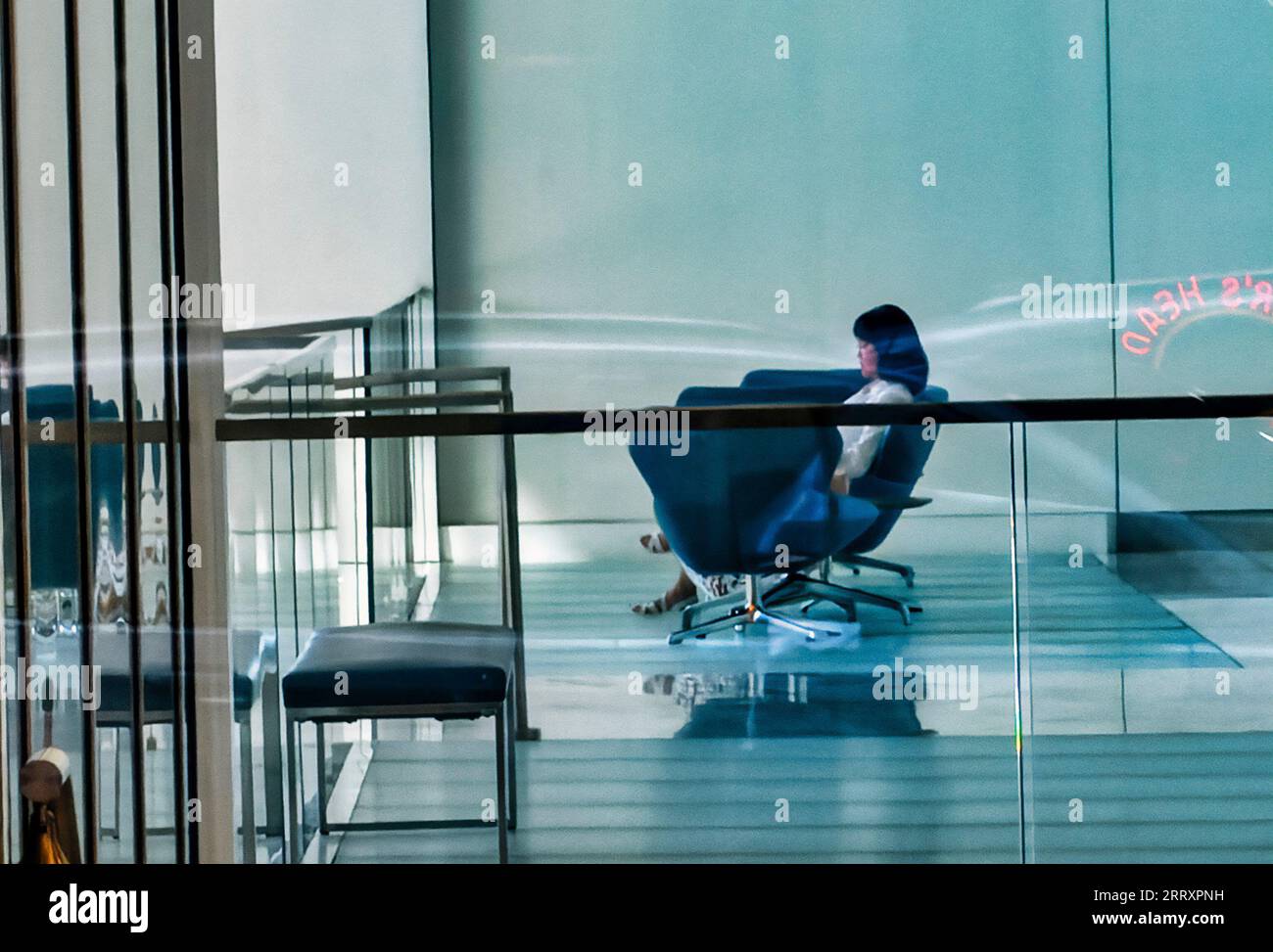 Woman seating alone hi-res stock photography and images - Alamy