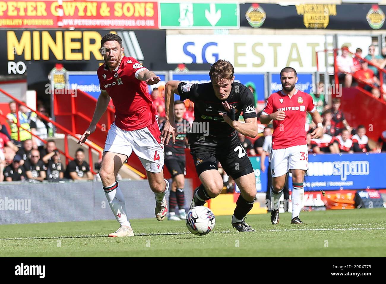 Wrexham, UK. 09th Sep, 2023. Ben Tozer of Wrexham (l) and Joe Ironside ...