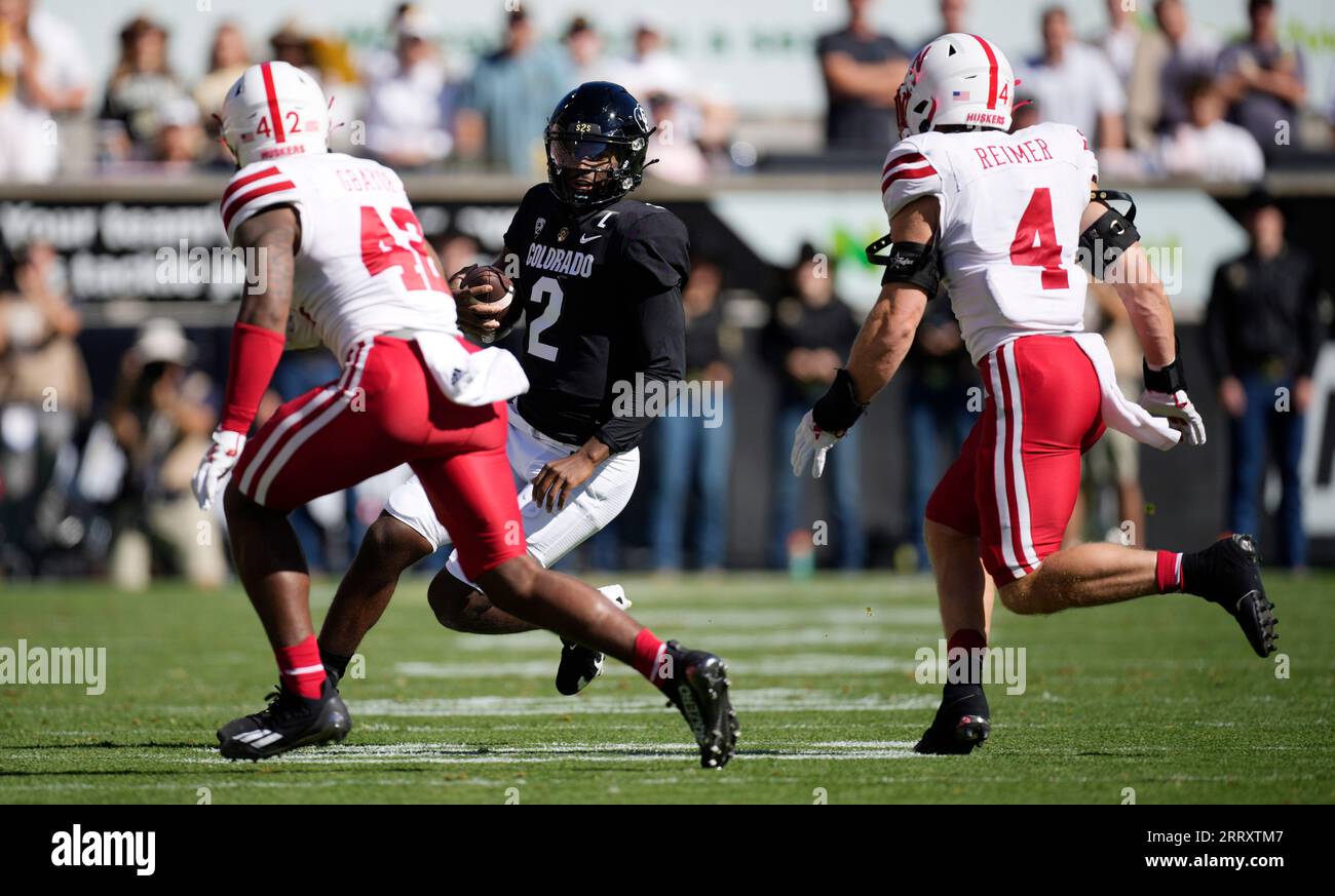 Colorado quarterback Shedeur Sanders, center, is pursued by Nebraska ...
