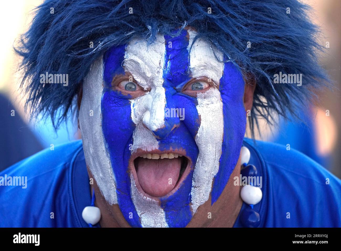 A BYU fan shows his support before an NCAA college football game ...
