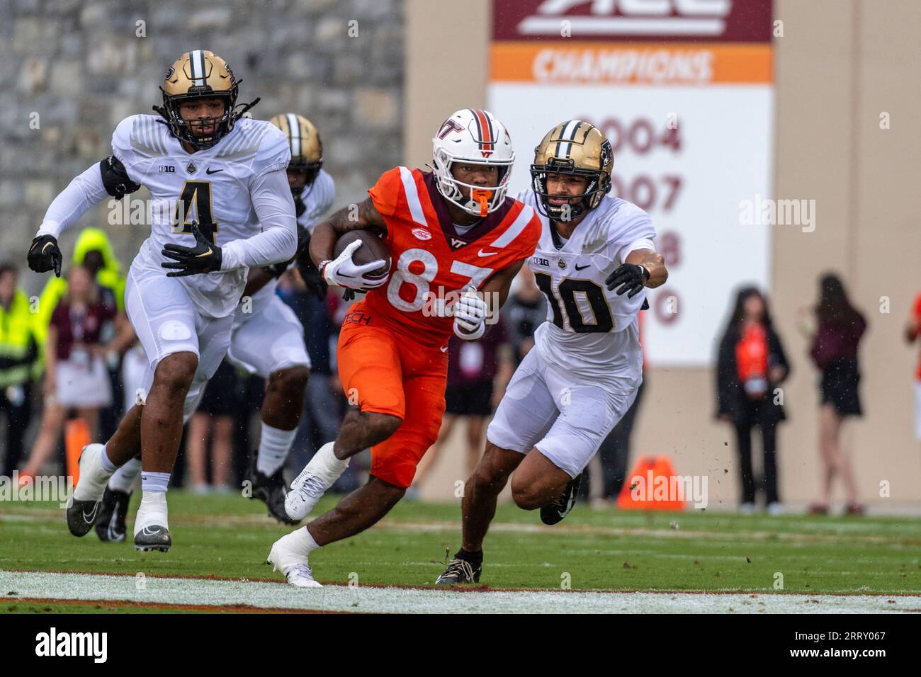 Virginia Tech's Kyle Lowe (83) runs by Purdue's Cam Allen (10) during ...