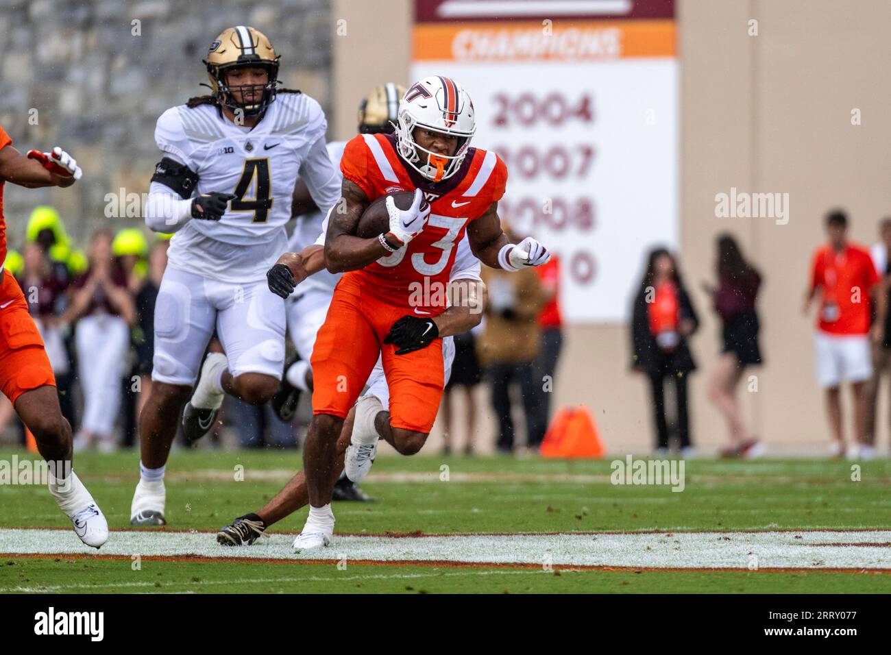 Virginia Tech's Kyle Lowe (83) runs by Purdue's Cam Allen (10) during ...