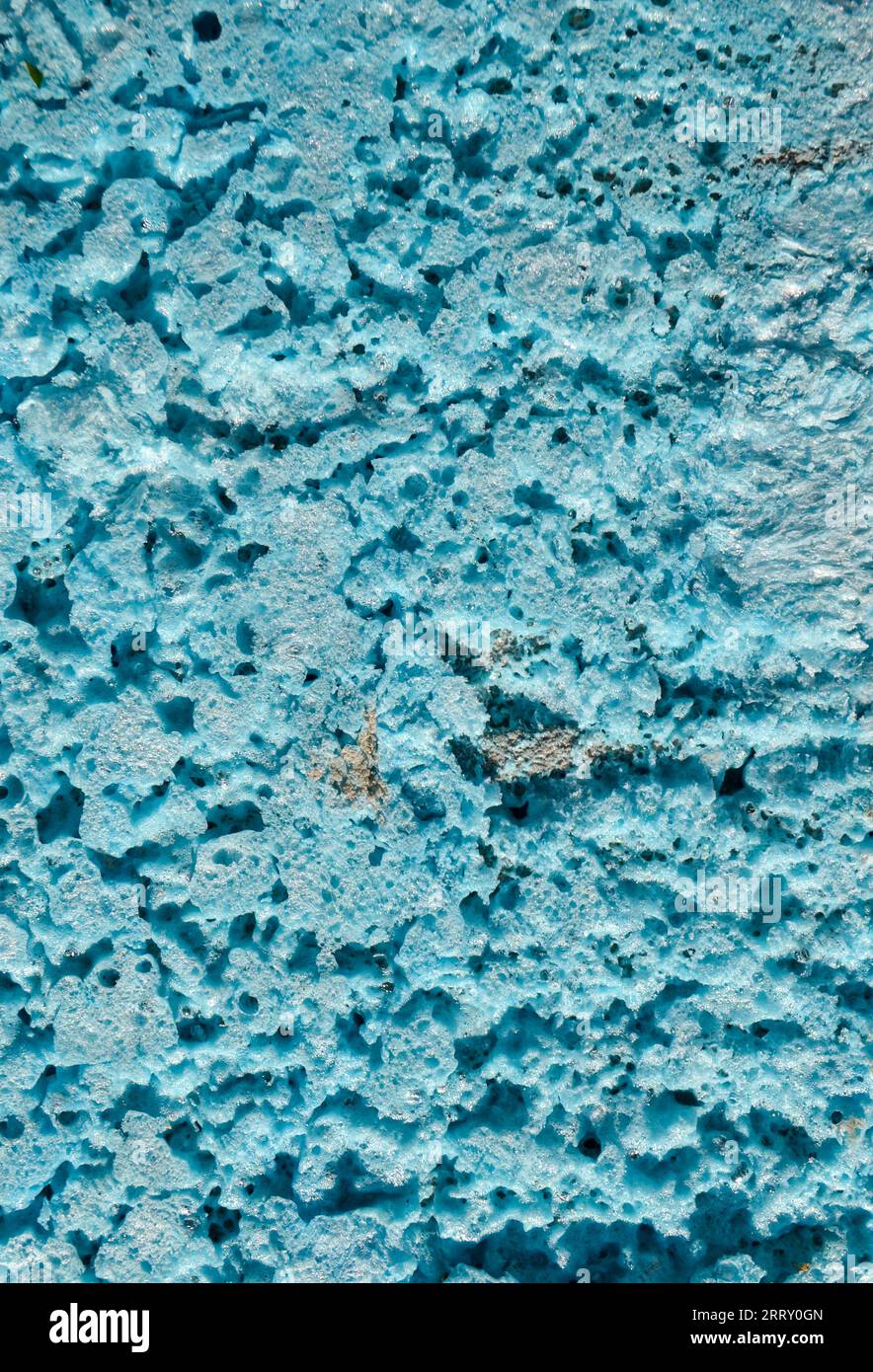 artistic texture blue polyurethane foam in a cut with elements of gray ...