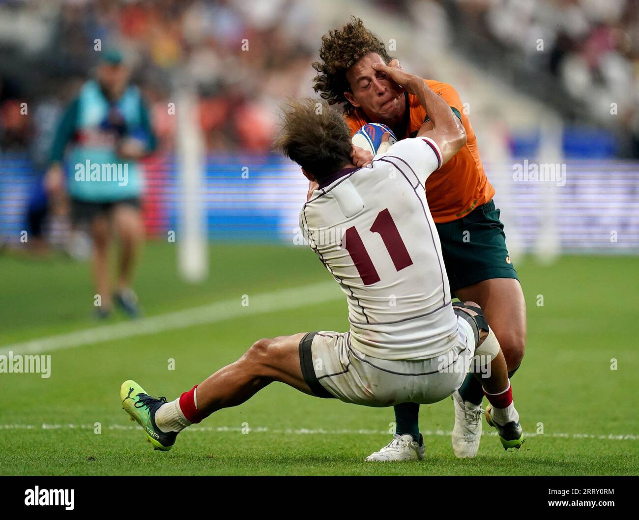 Australia's Mark Nawaqanitawasi (right) is tackled by Georgia's Miriani ...