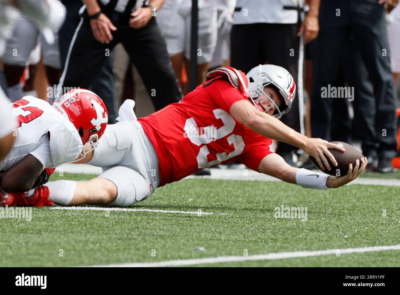Ohio State quarterback Devin Brown stretches for a first down against ...