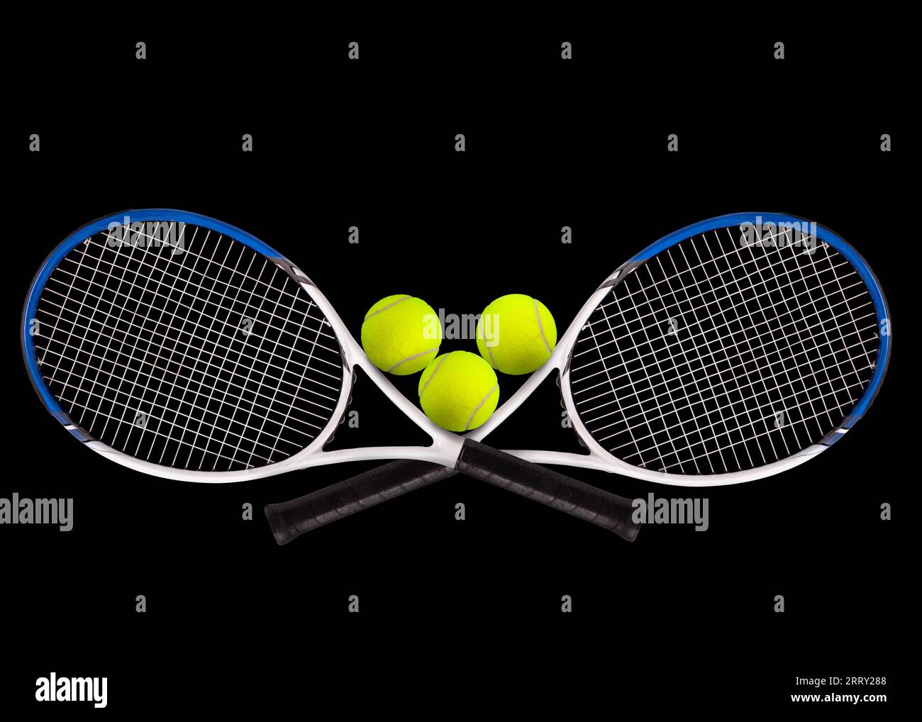 Two tennis racquets crossing with yellow tennis balls isolated on a ...