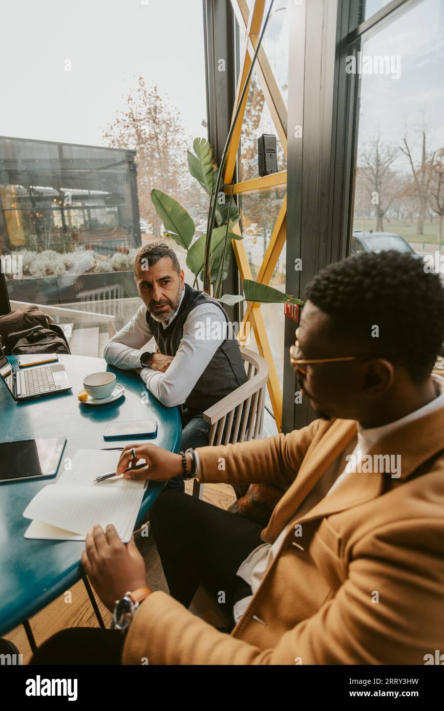 Two handsome business men sitting hi-res stock photography and images ...