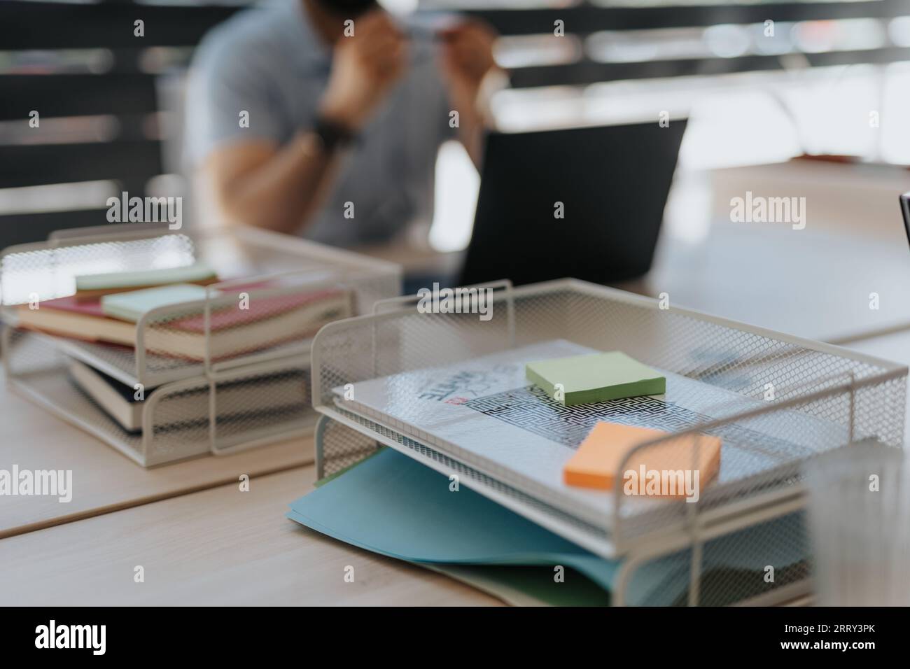 Business supplies on a working desk, sticky notes, notebook, documents ...