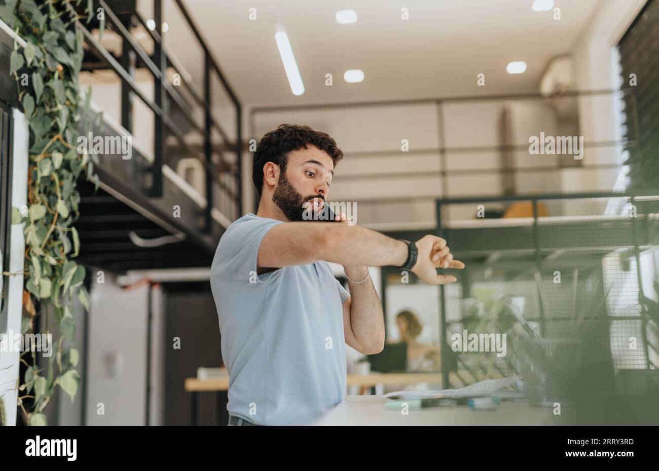 Good looking businessman telling his client that he is late at meeting ...