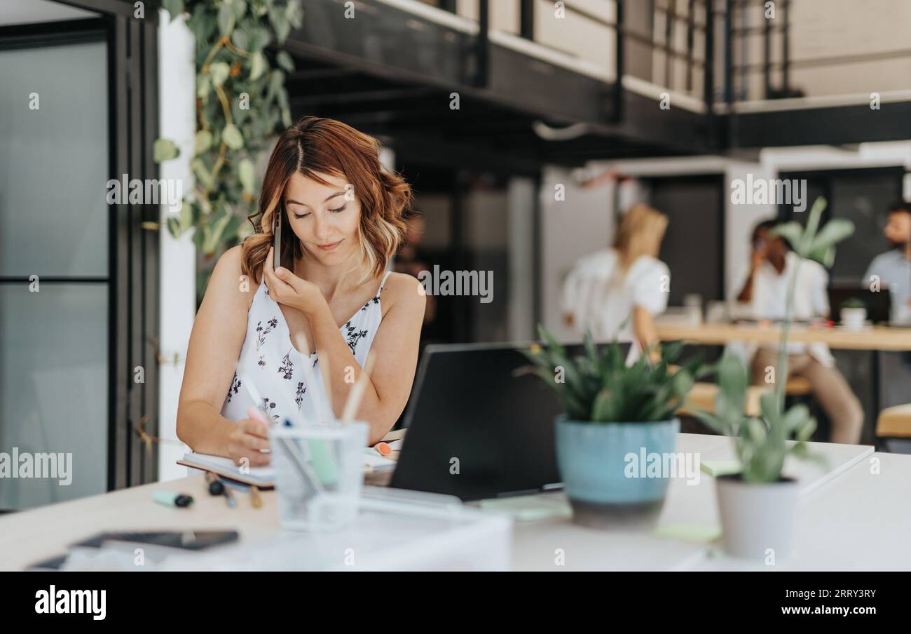Diverse group of professionals in an office, collaborating on a project ...
