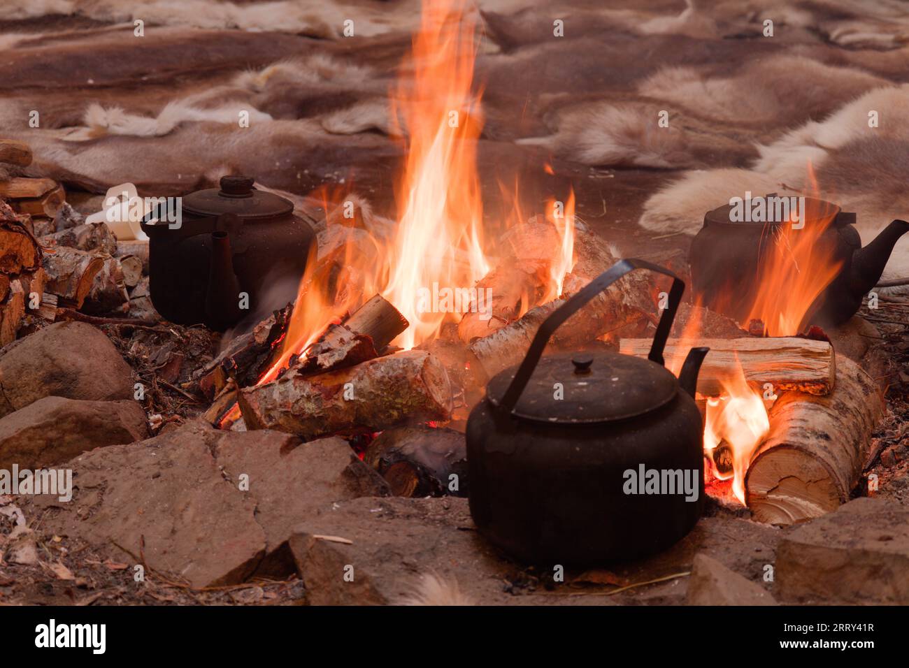 Campfire inside a Norwegian Lavuu Stock Photo - Alamy