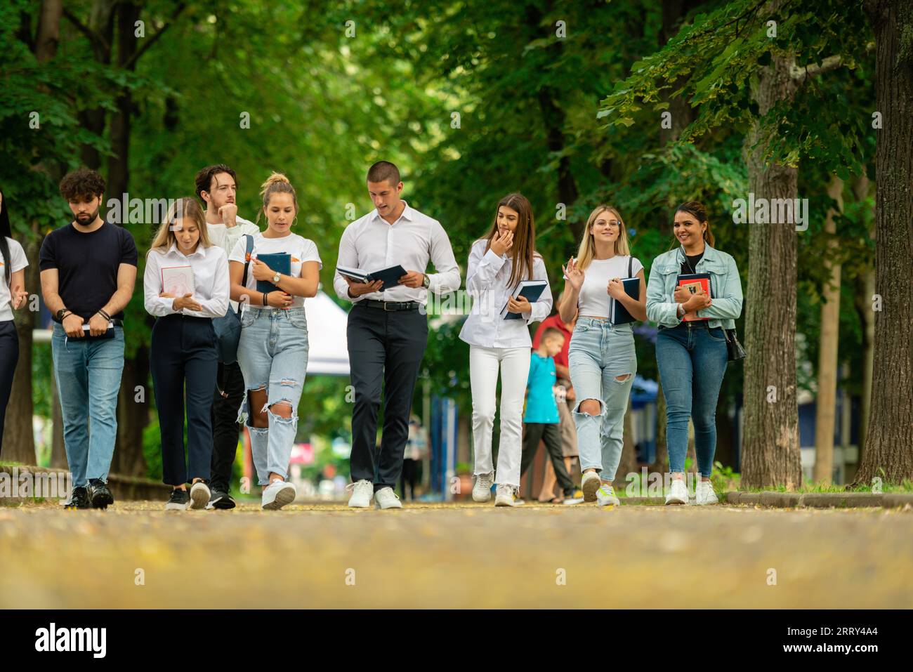 High school classmates walking happy hi-res stock photography and ...