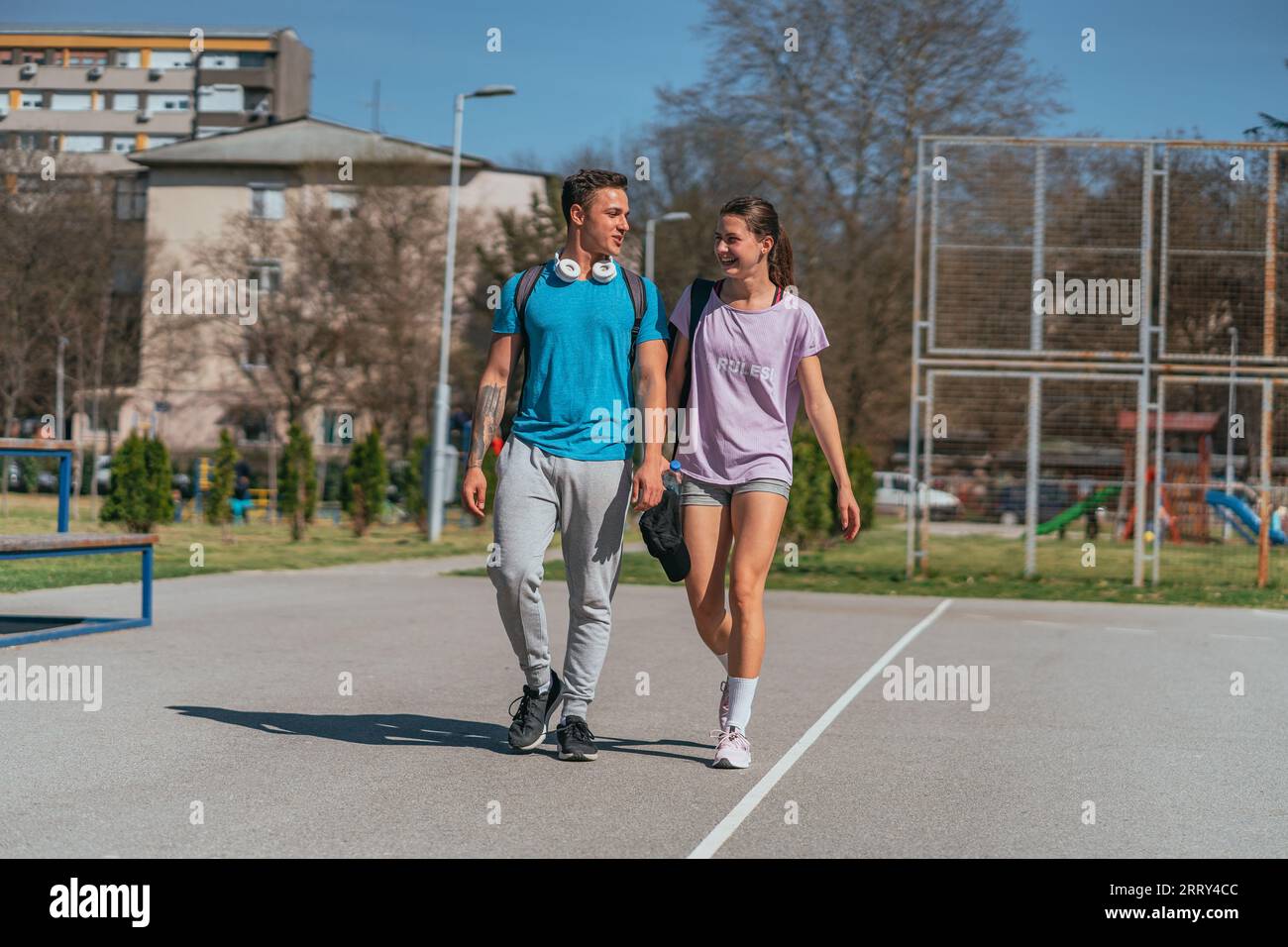 An exhausted sporty couple just finished their training. They are ...