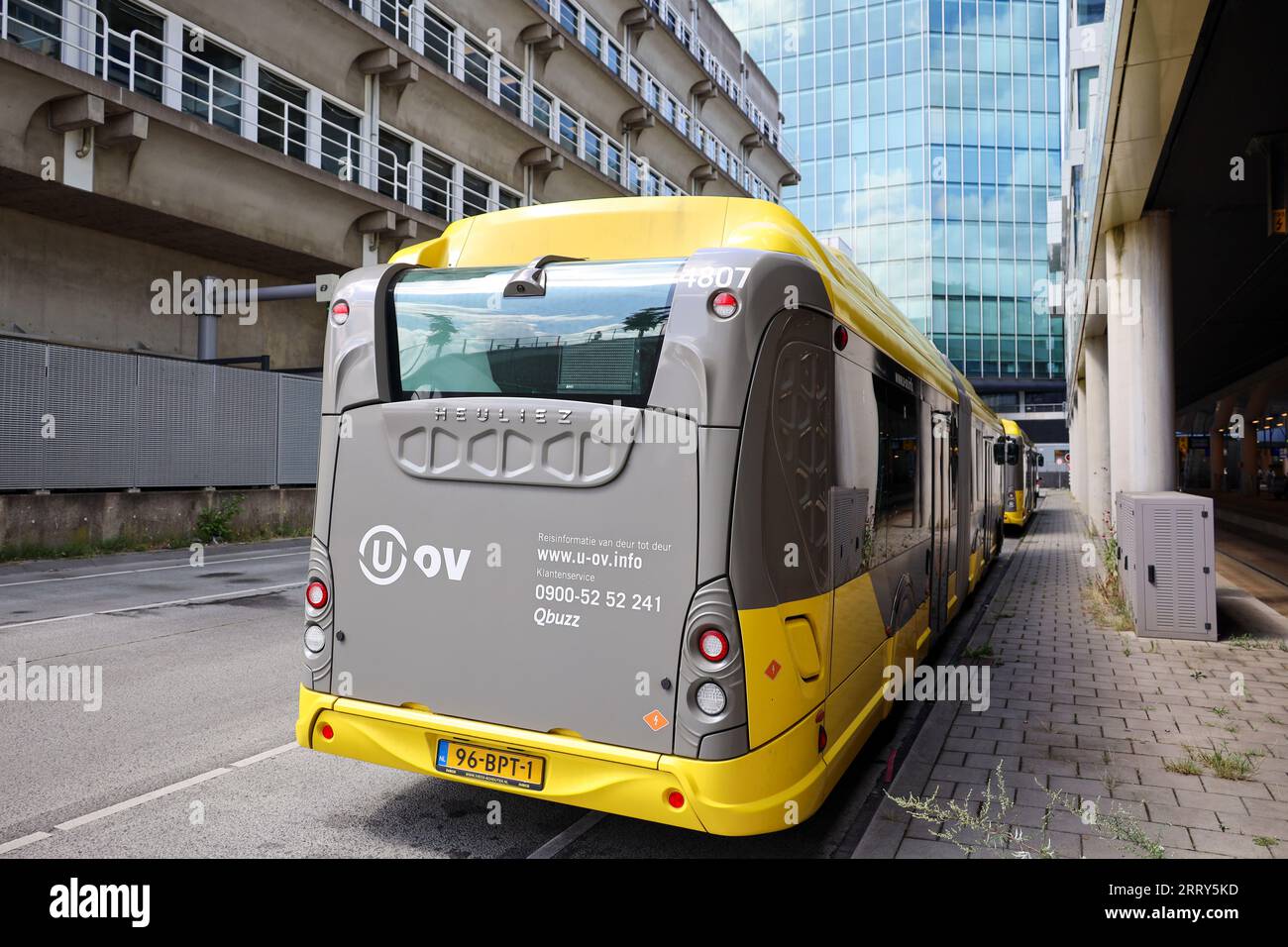 Articulated city bus in yellow colour of U-OV in the city of Utrecht ...