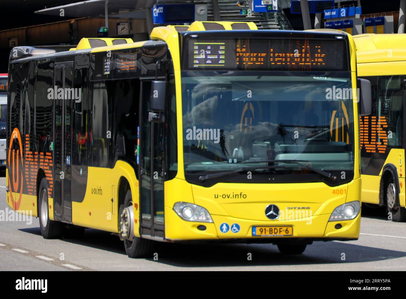 City bus in yellow color of U-OV runned by Qbuzz in Utrecht the ...