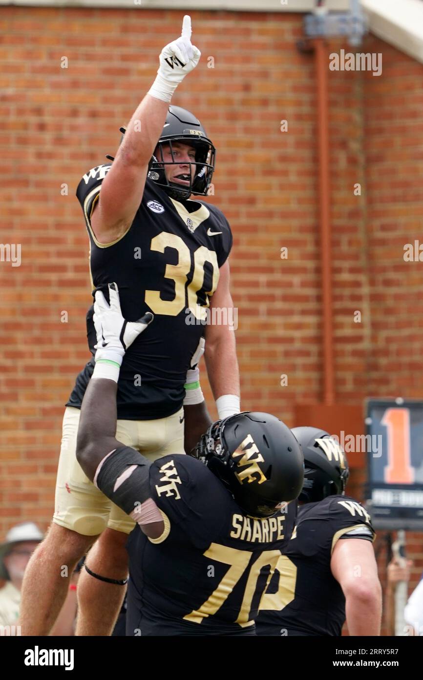 Wake Forest running back Tate Carney (30) celebrates his touchdown run ...