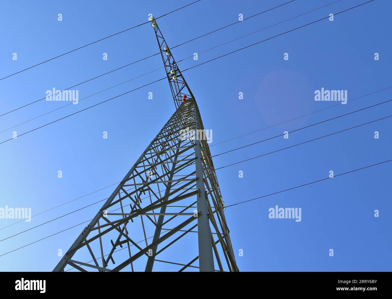 Close Up View On A Big Power Pylon Transporting Electricity In A ...