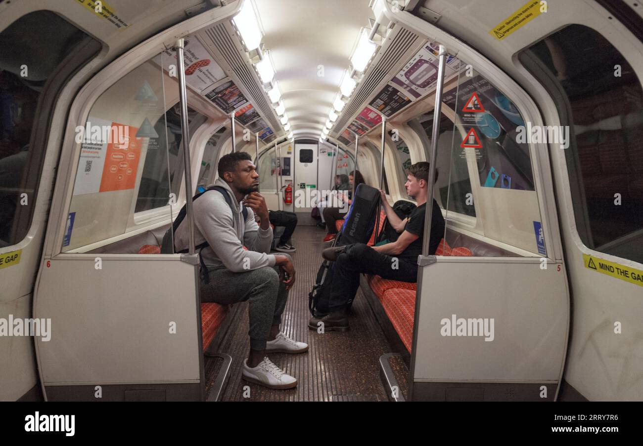 Passengers on the Glasgow SPT subway showing the longitudinal seating ...