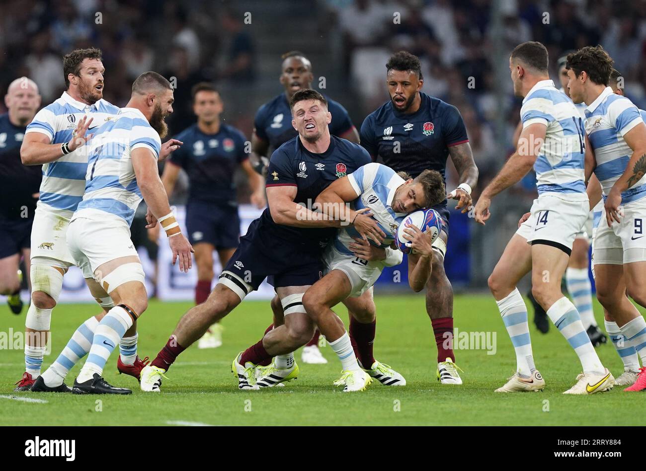 England's Tom Curry (left) makes head on head contact with Argentina's ...