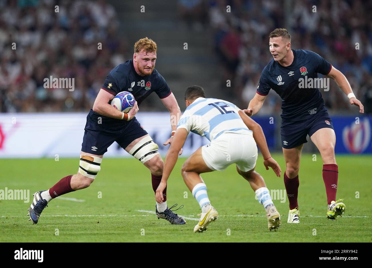 England's Ollie Chessum (left) and Argentina's Juan Mallia in action ...