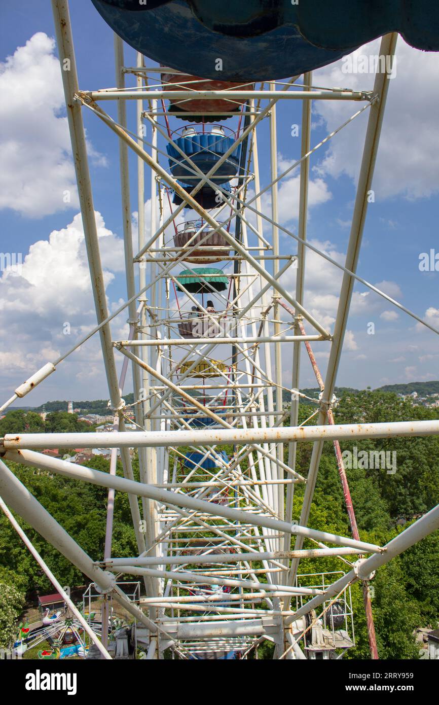 sitting on the Ferris wheel rides and spin in a circle Stock Photo - Alamy