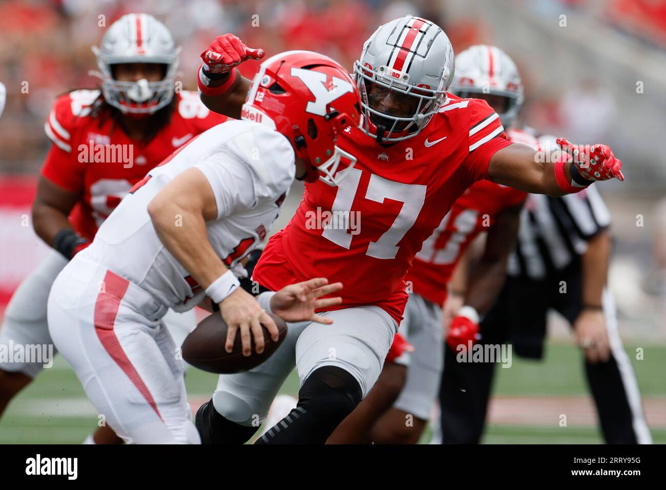 Ohio State linebacker Mitchell Melton, right, rushes Youngstown State ...