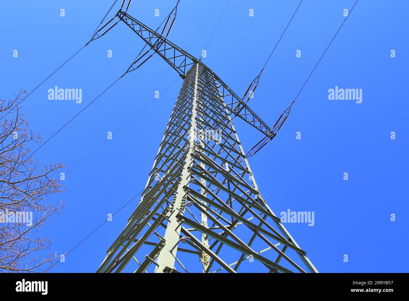 Close Up View On A Big Power Pylon Transporting Electricity In A ...