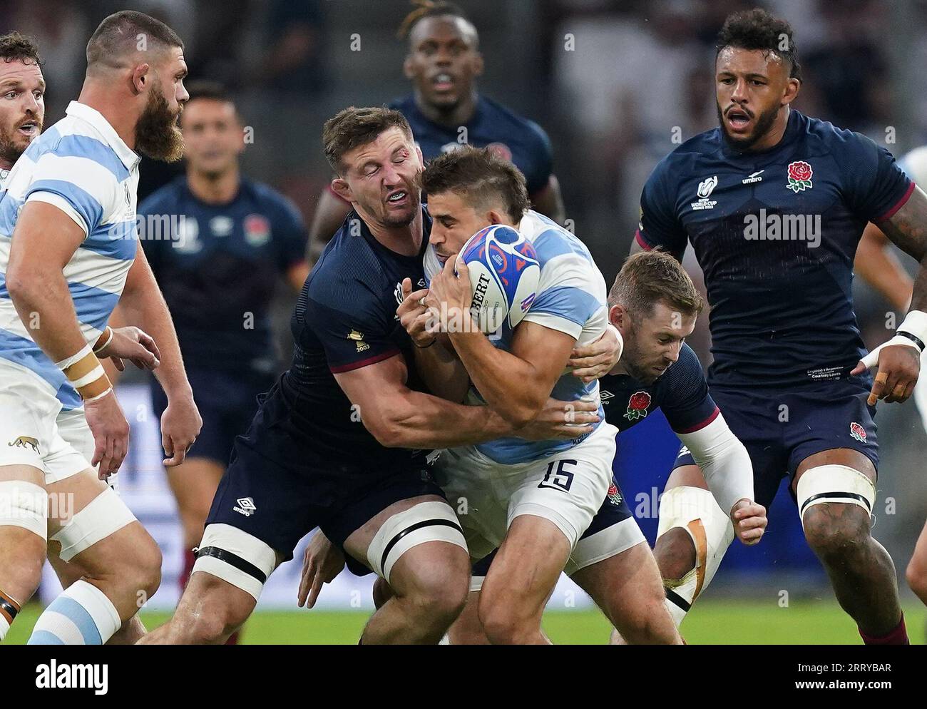 England's Tom Curry (left) makes head on head contact with Argentina's ...
