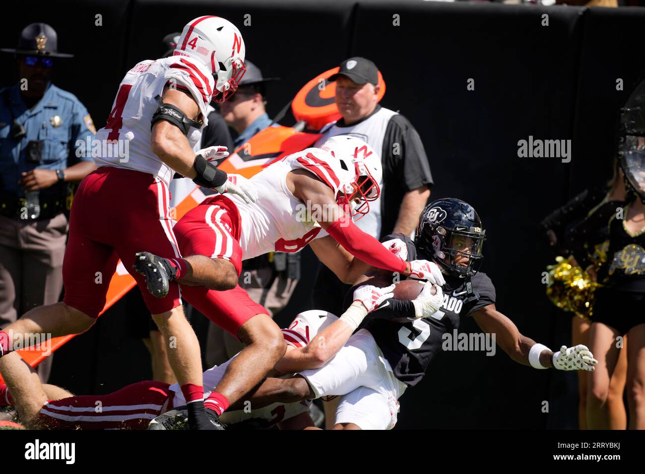 Colorado wide receiver Jimmy Horn Jr., right, is pushed out of bounds ...
